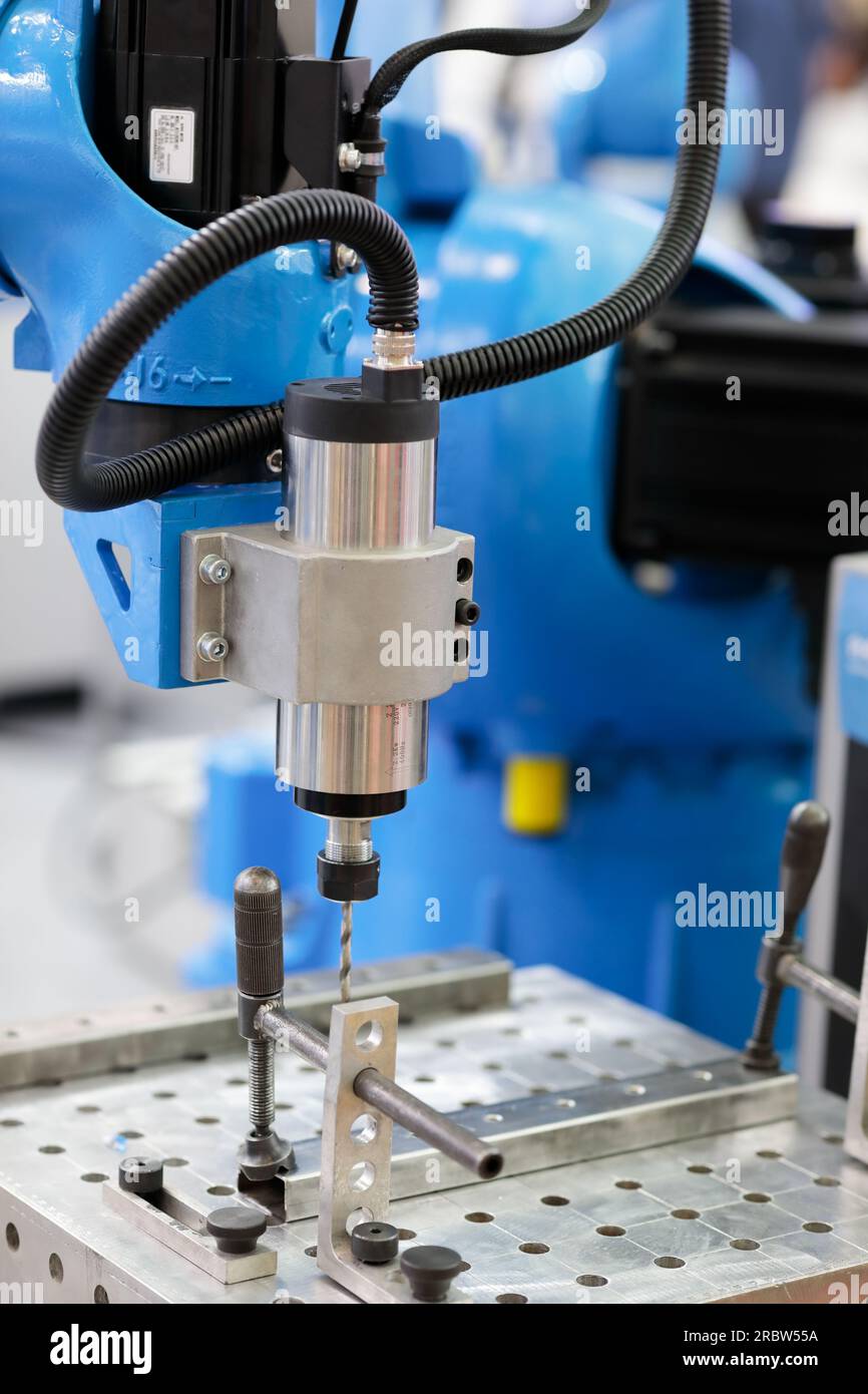 Automated robotic drilling and tapping machine. Close up photo ...