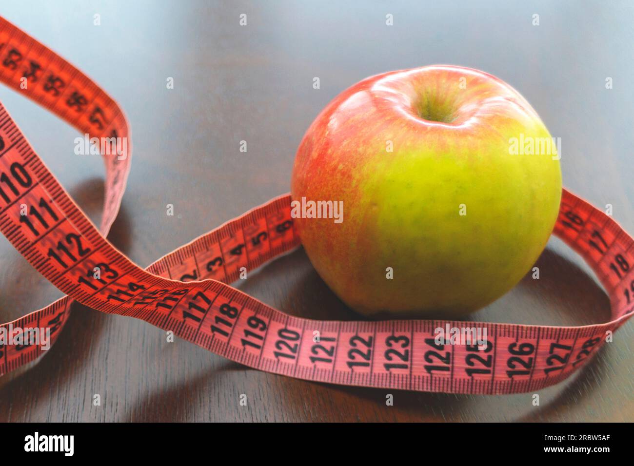 Close up apple, meter tape. Concept Healthy way of life.The first step ...