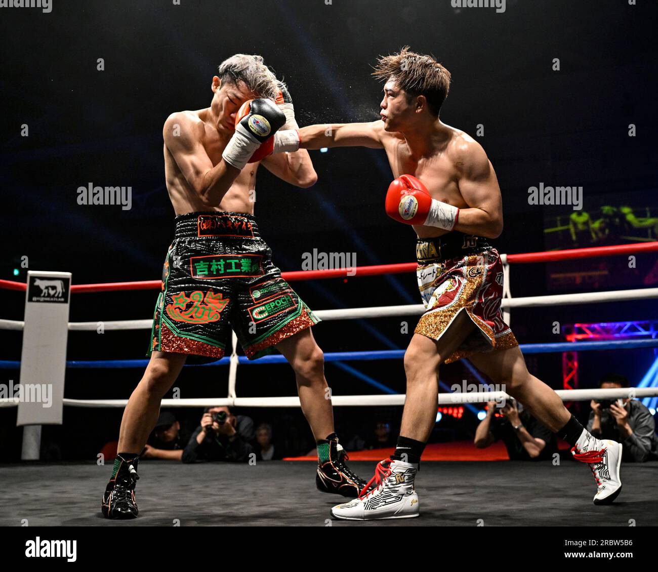 Jin Sasaki (red gloves) and Hiroto Hoshi (black gloves) compete during their WBO Asia Pacific ...