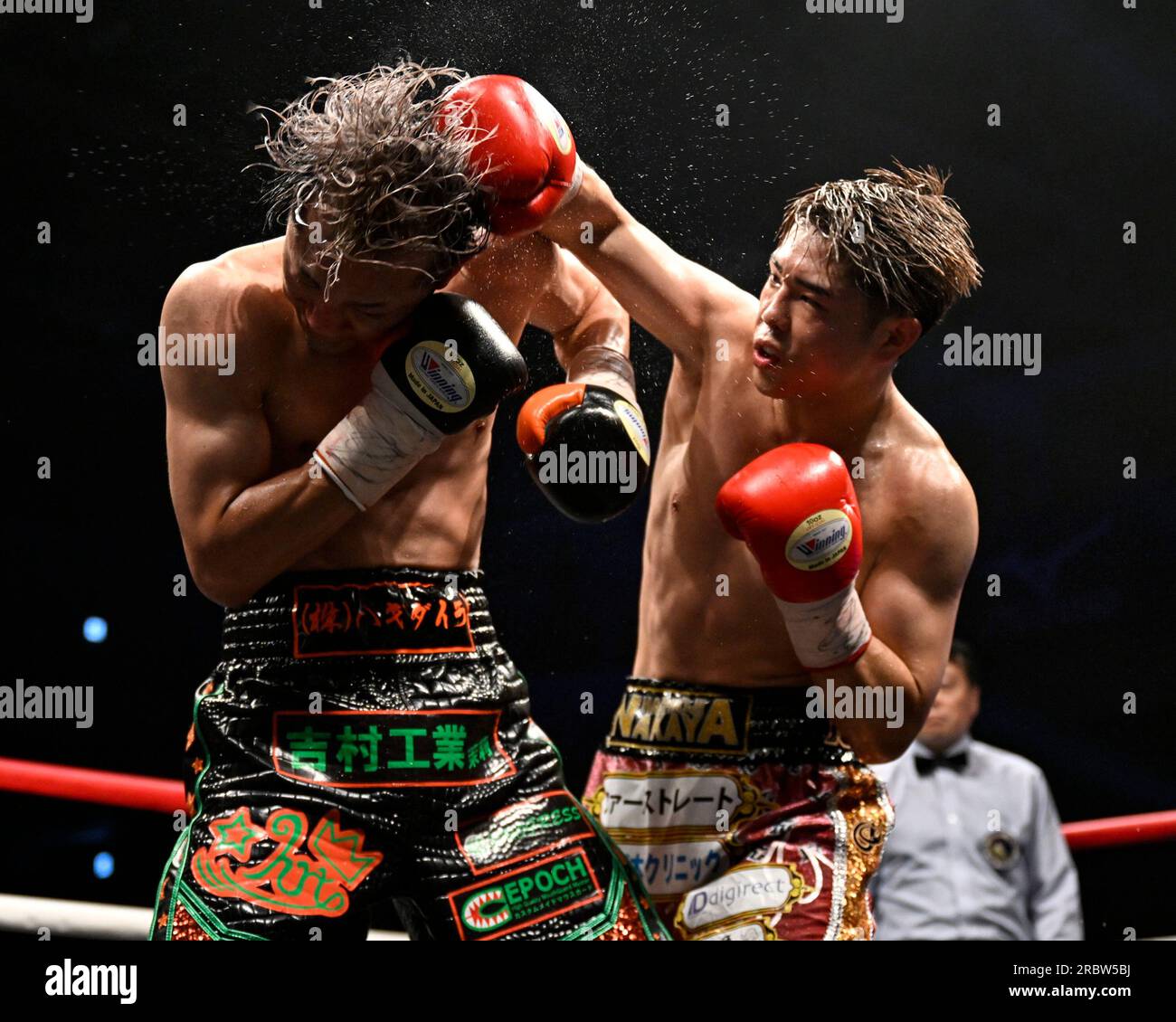 Jin Sasaki (red gloves) and Hiroto Hoshi (black gloves) compete during ...