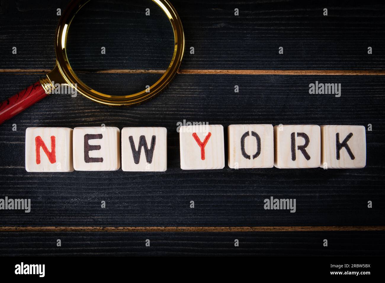 New York. Word from alphabet blocks and magnifying glass on wood ...