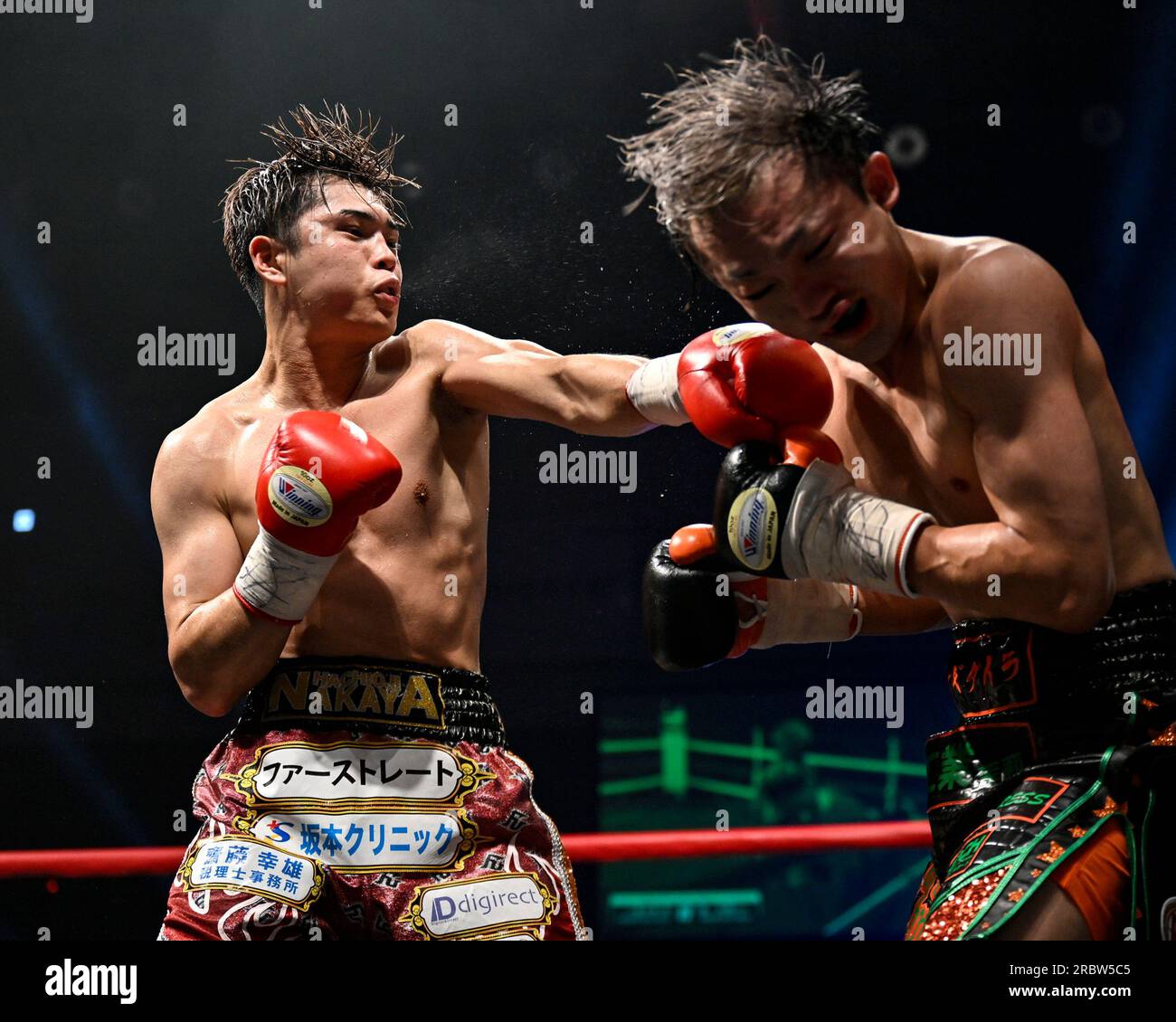 Jin Sasaki (red gloves) and Hiroto Hoshi (black gloves) compete during their WBO Asia Pacific ...