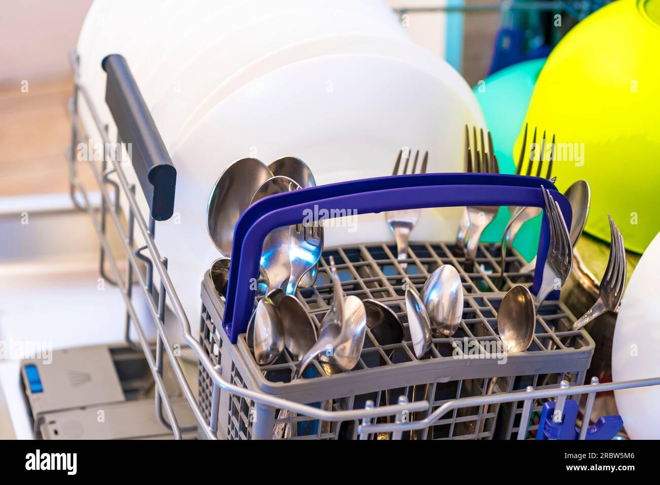 Open dishwasher. The washed dishes. Clean cutlery. Kitchen hygiene ...