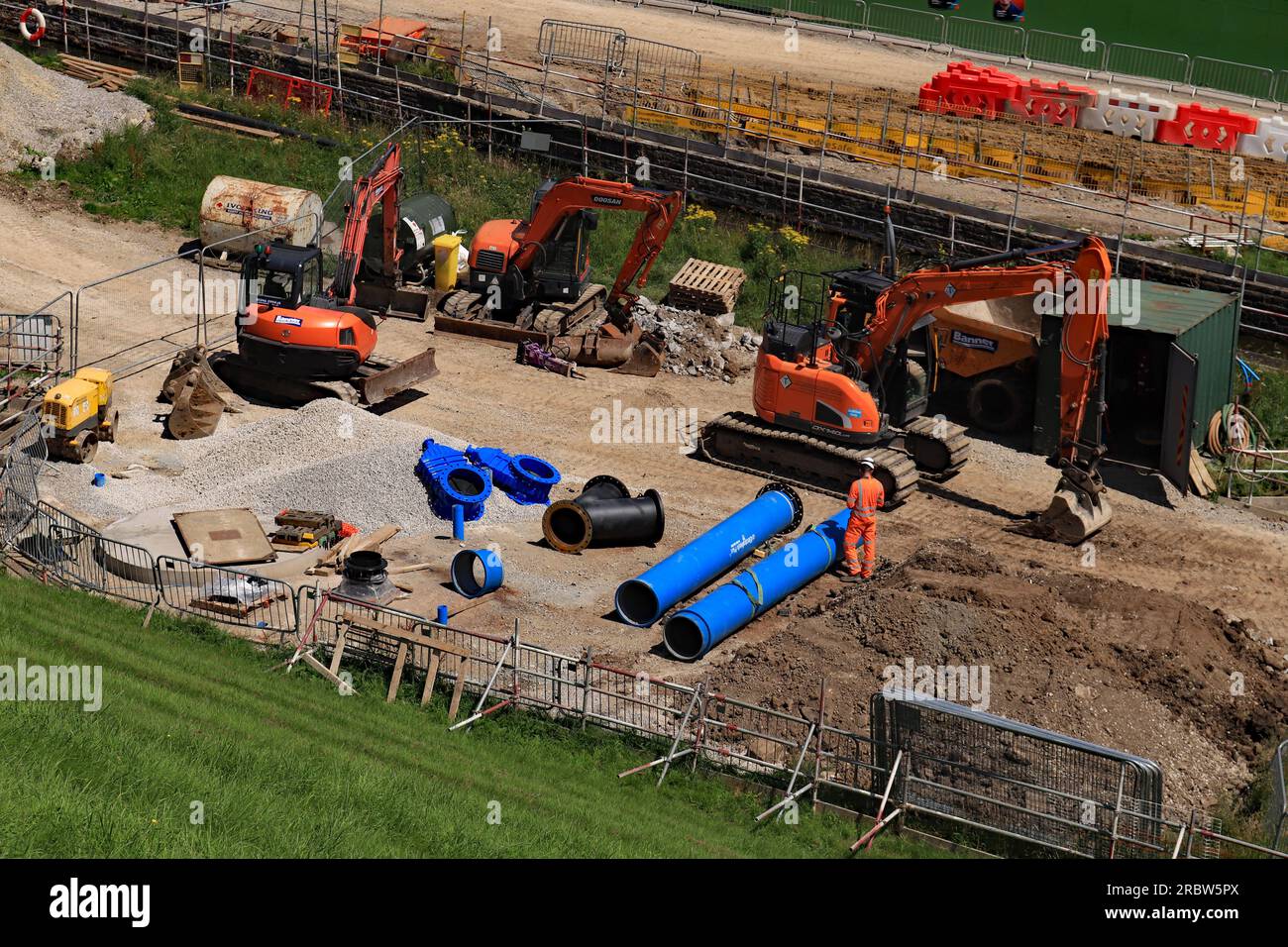 View from the top of Toddbrook dam down as big blue water control ...