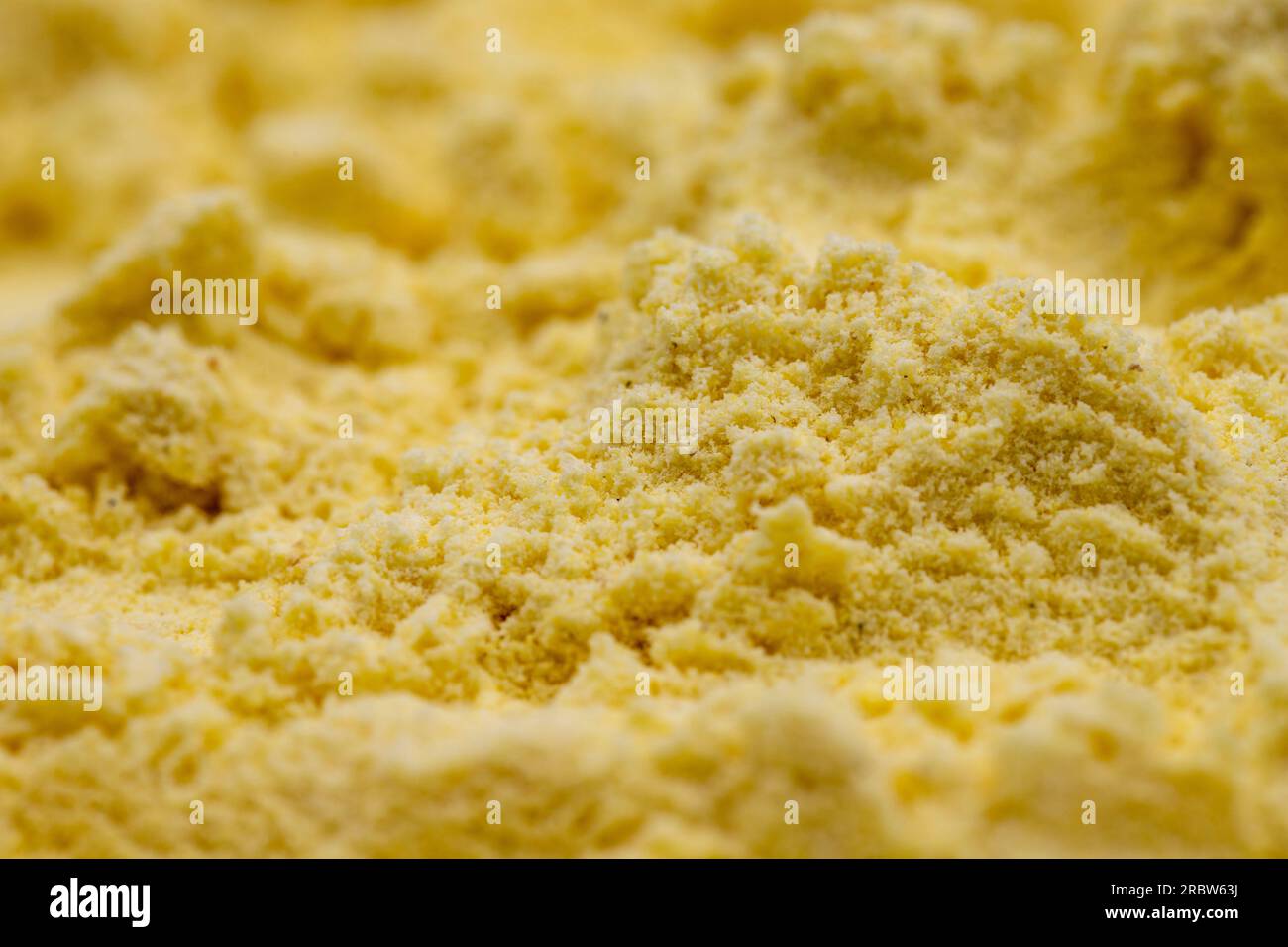 Pile of corn flour as background, spice or seasoning as background ...