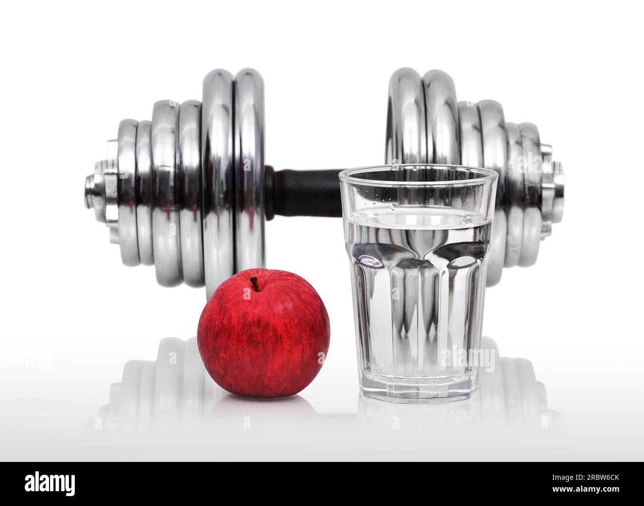dumbbell, cup and apple on a white background Stock Photo - Alamy