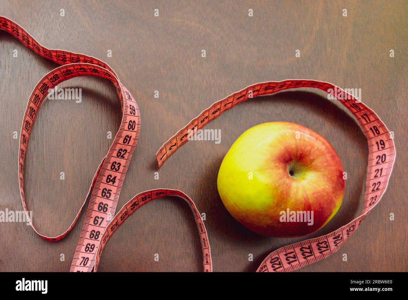 Close up apple, meter tape. Concept Healthy way of life.The first step ...