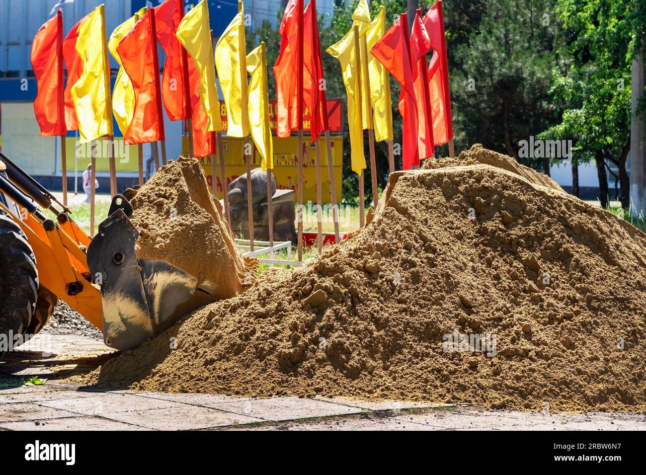 Excavator bucket with sand.Tractor near a pile of sand. Road ...