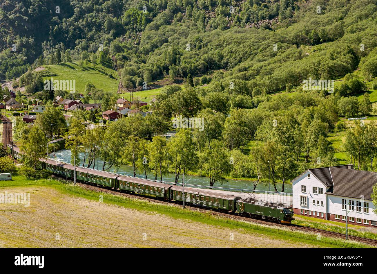 Flamsbana Train at Flamsdalen Valley and the village Lunden, Norway Stock Photo - Alamy