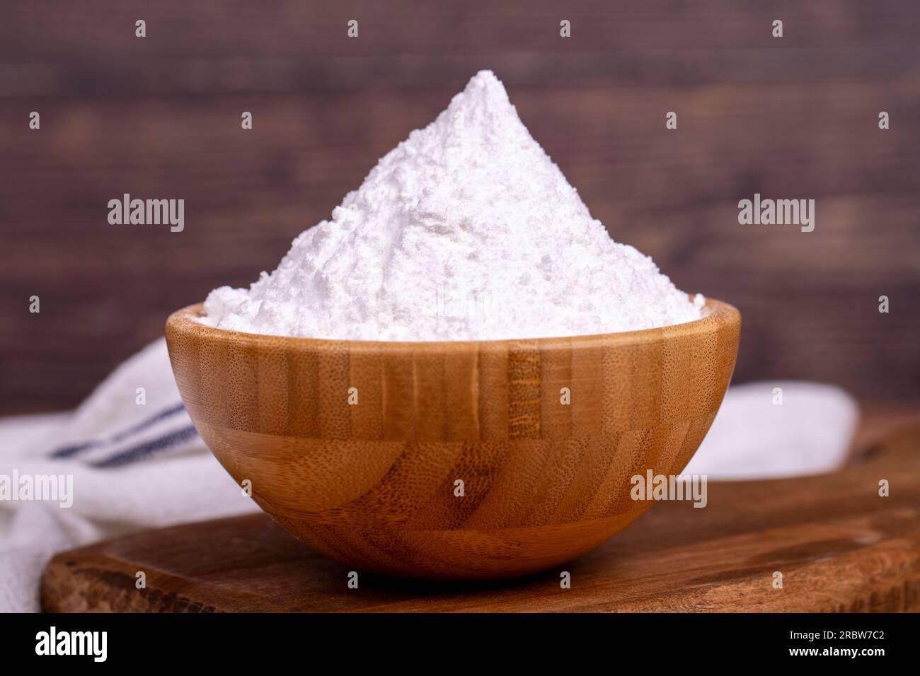 Wheat starch on wood background. Wheat starch in wooden bowl. close up ...