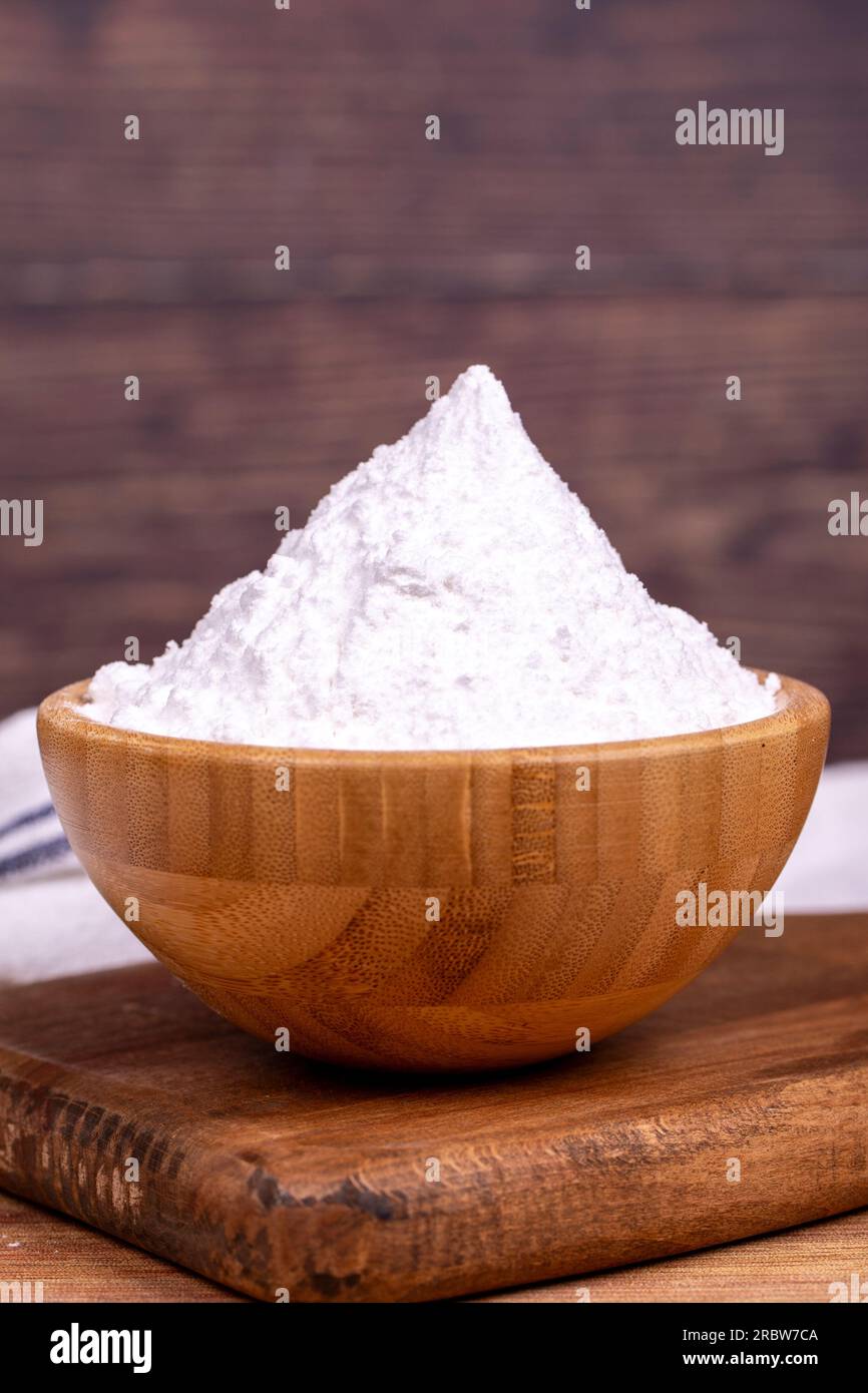 Wheat starch on wood background. Wheat starch in wooden bowl. close up ...
