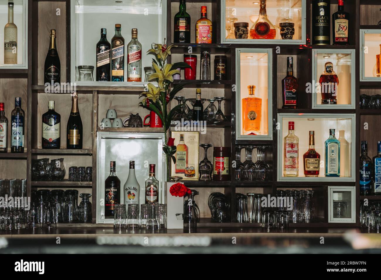 Alcohol Bottles On Restaurant Bar with nice lighting on Shelves. Modern ...