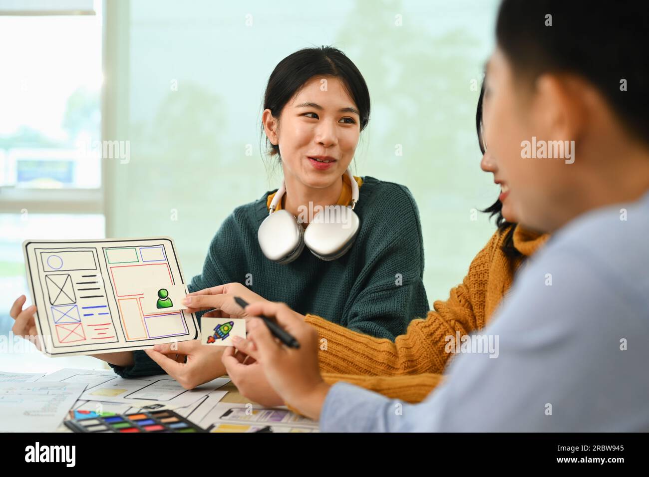 Team Of Creative People Brainstorming And Discussing For Mobile Application Software Design