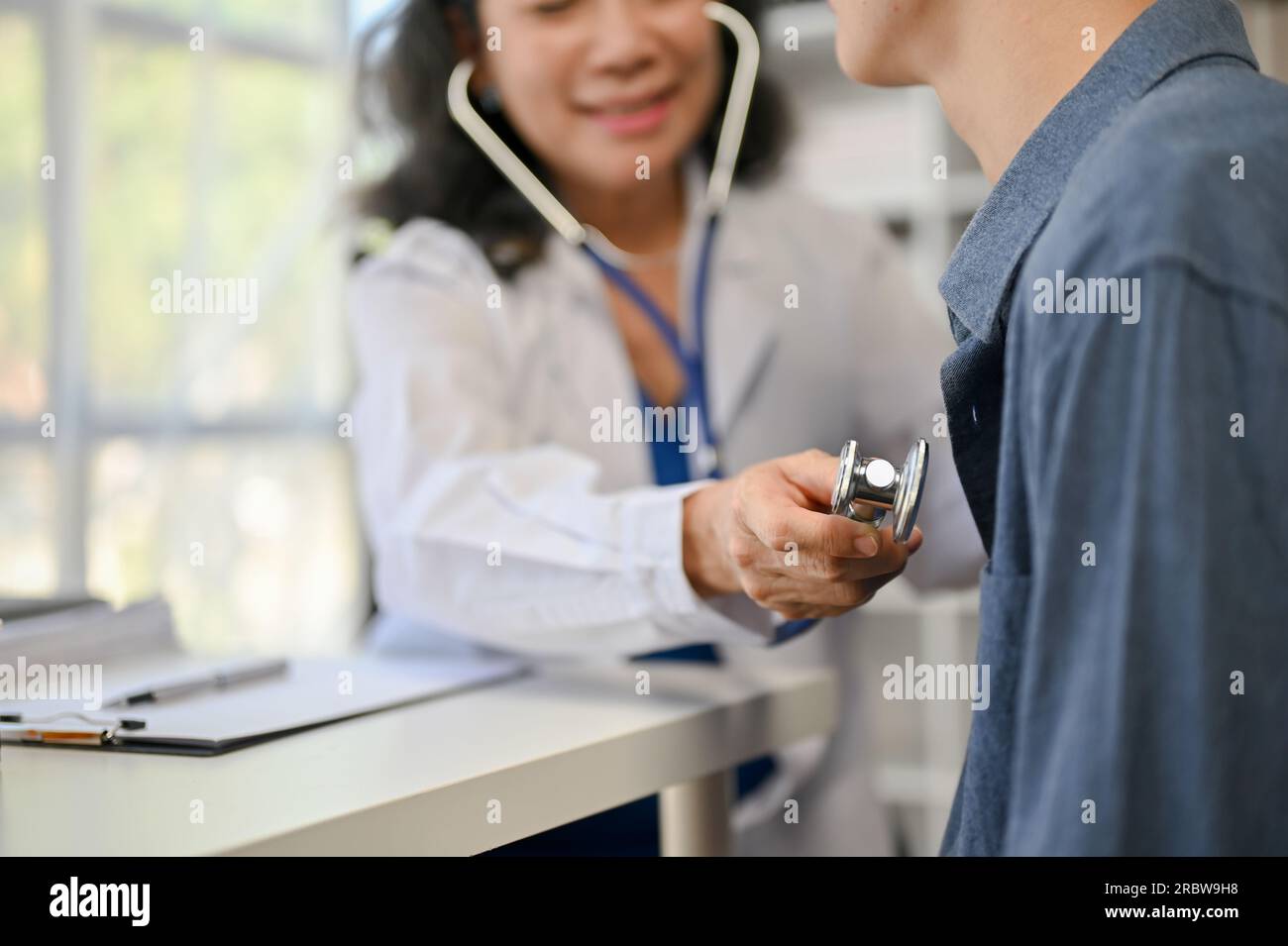 Close-up image of a professional Asian senior female doctor is checking ...