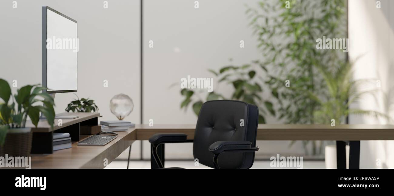 Side view of an office desk with a computer, potted plants, and decor ...