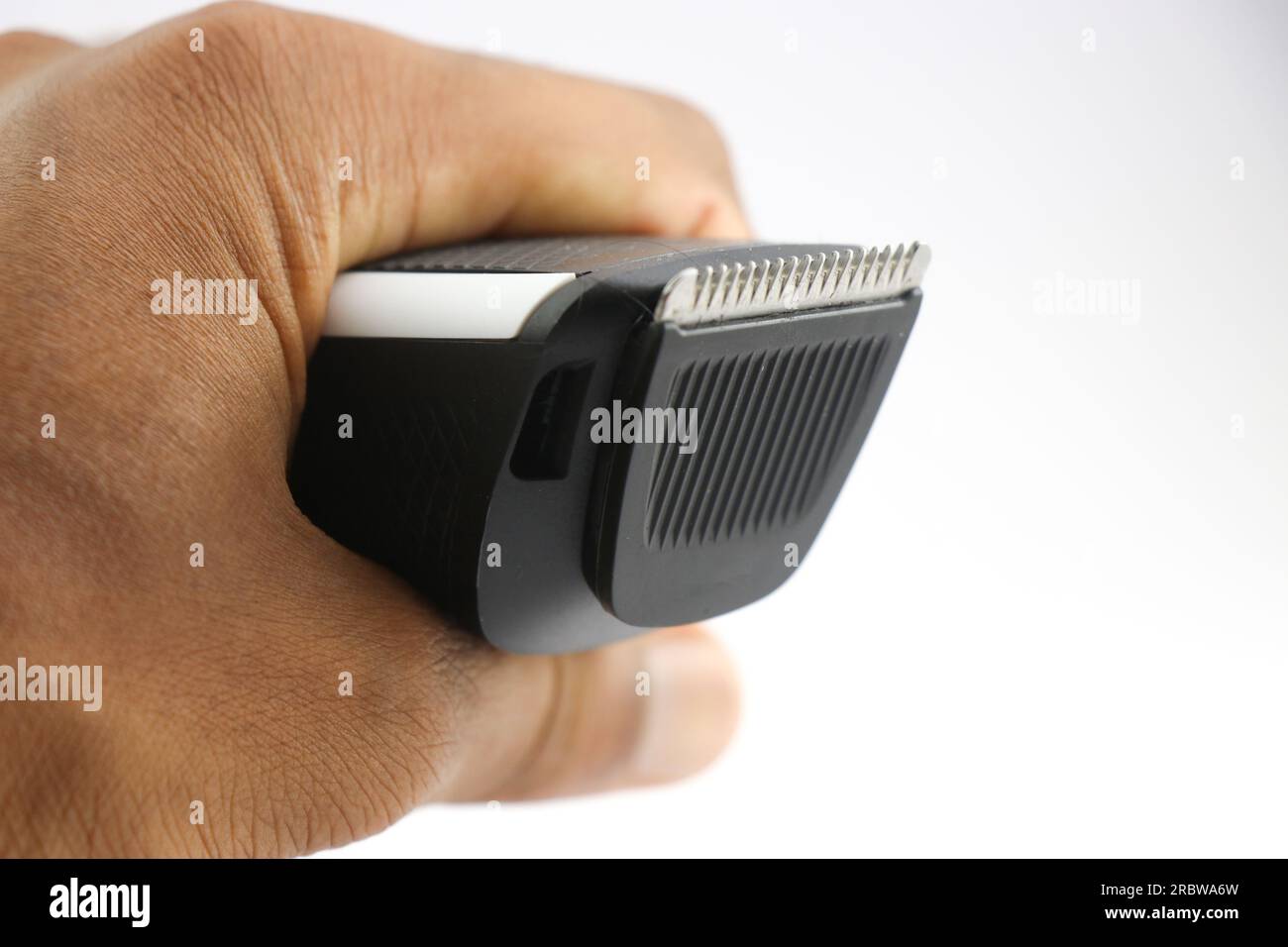 Blades of a hair trimming machine closeup view with trimmer machine ...