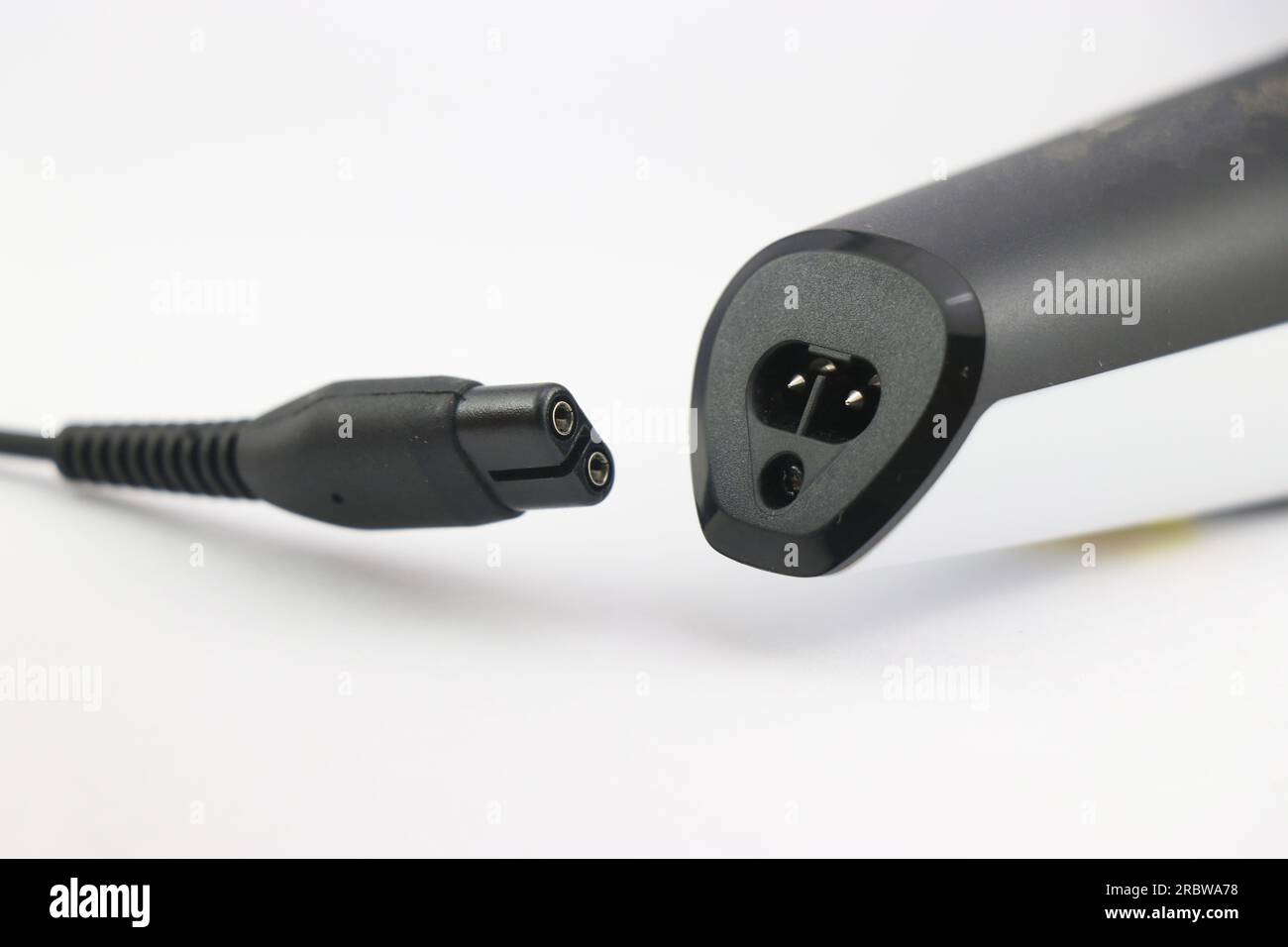 Trimmer machine with a view of its power plug for charging the device ...