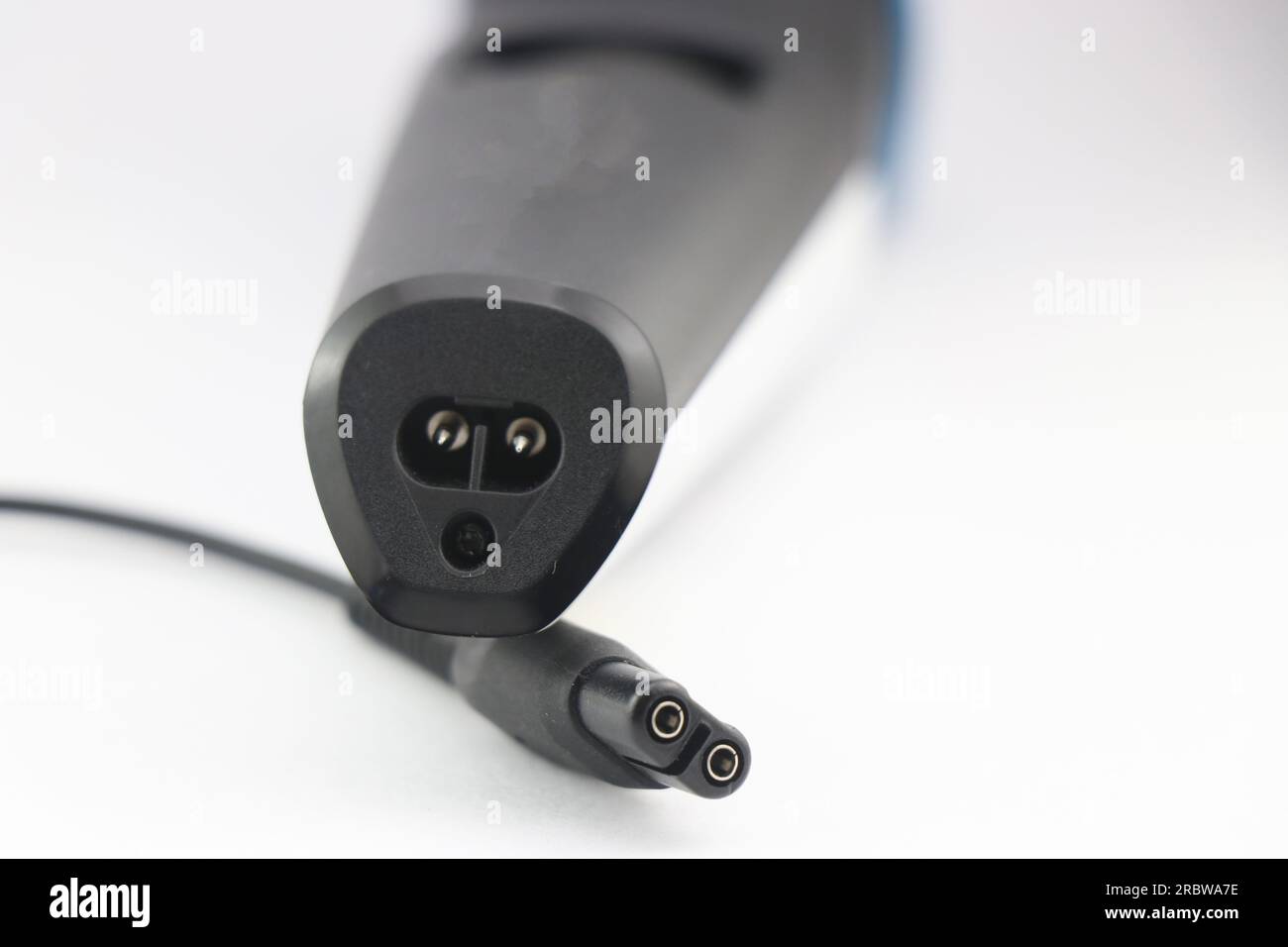 Charging point of a hair trimmer machine and the power plug point of ...