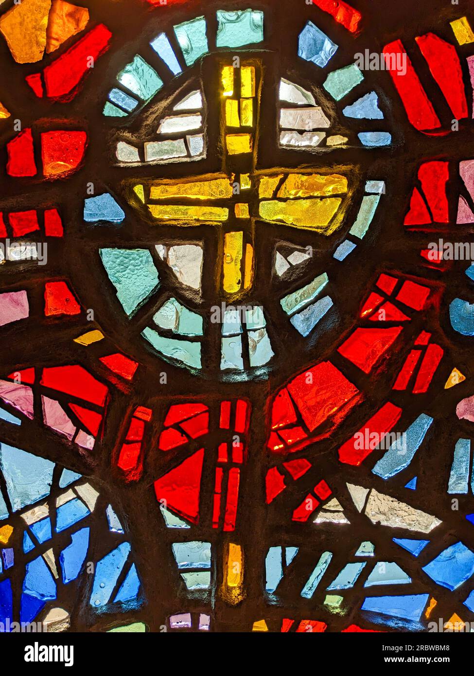 Window in the church, stained glass, colored mosaic in the form of a ...