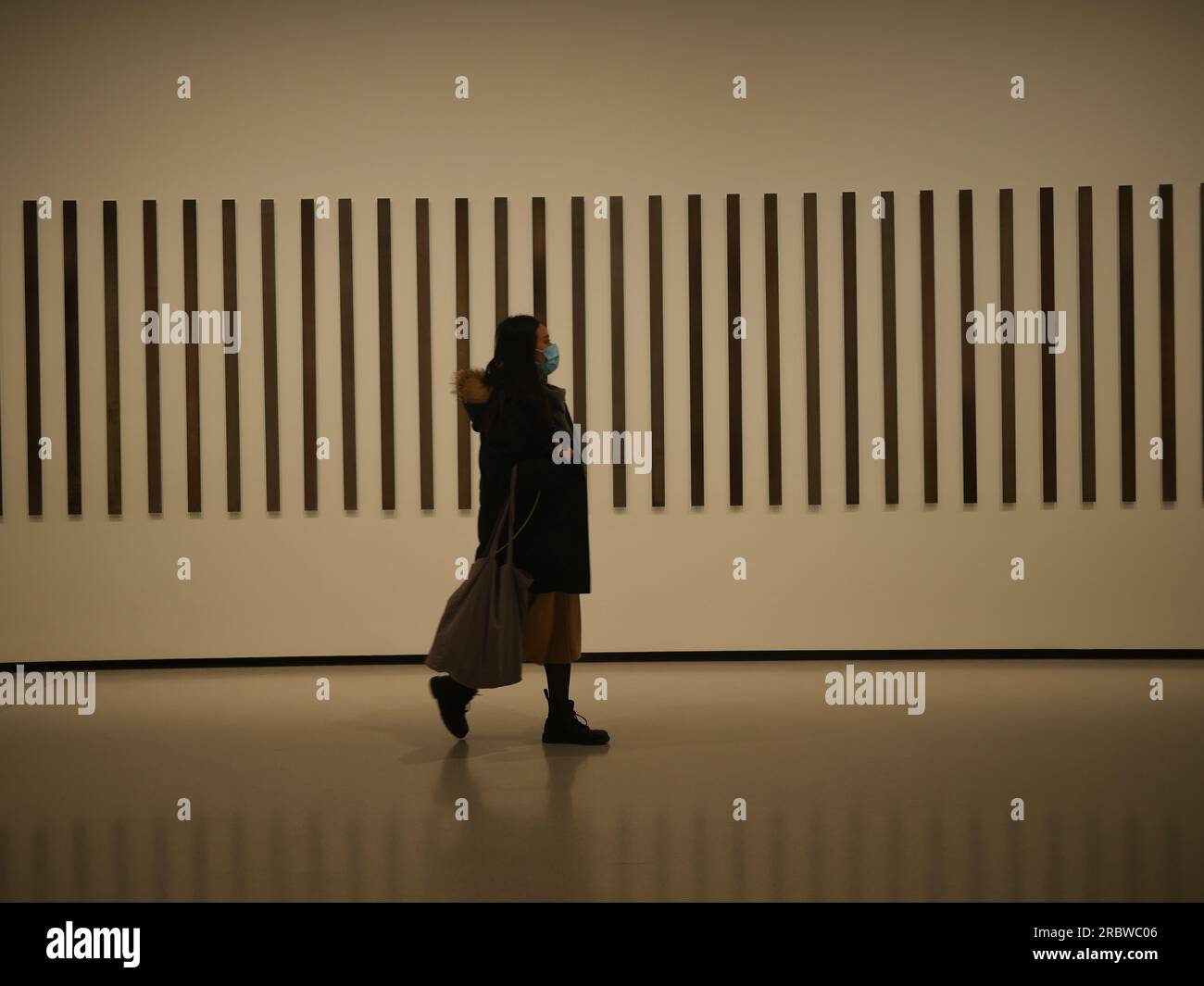 A girl walking in the room Stock Photo - Alamy