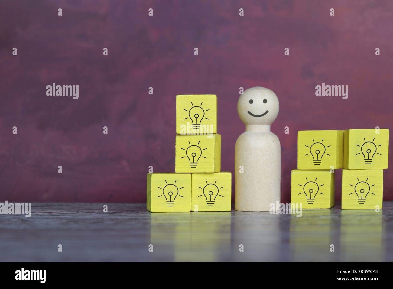 Wooden doll with lightbulbs icon. Full of ideas, inventive, imaginative ...