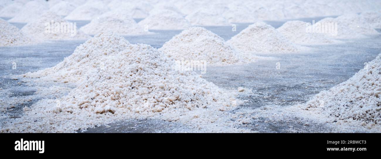 Sea salt farm. Pile of brine salt. Raw material of salt industrial ...