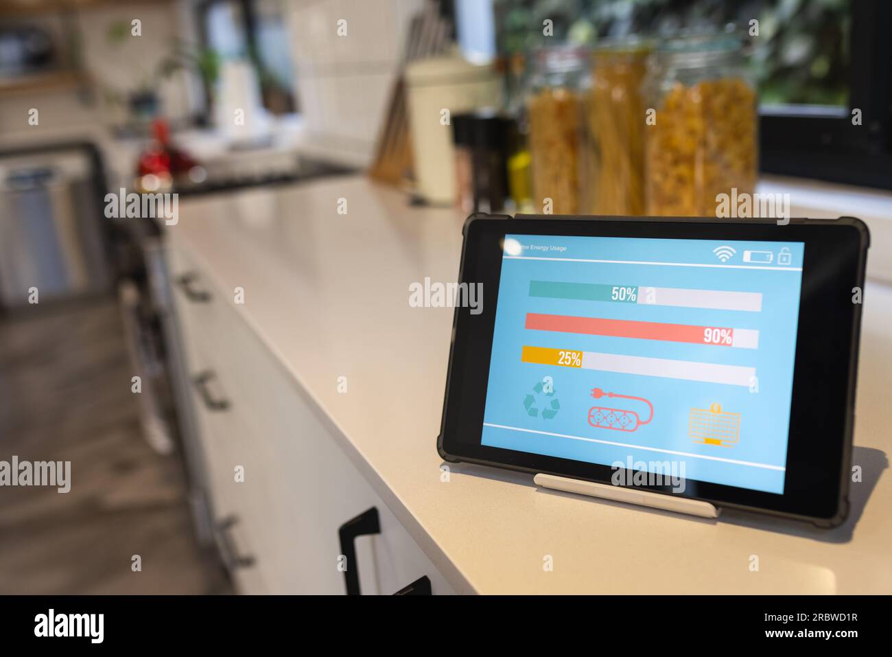 Tablet with smart home interface on white worktop in kitchen Stock ...