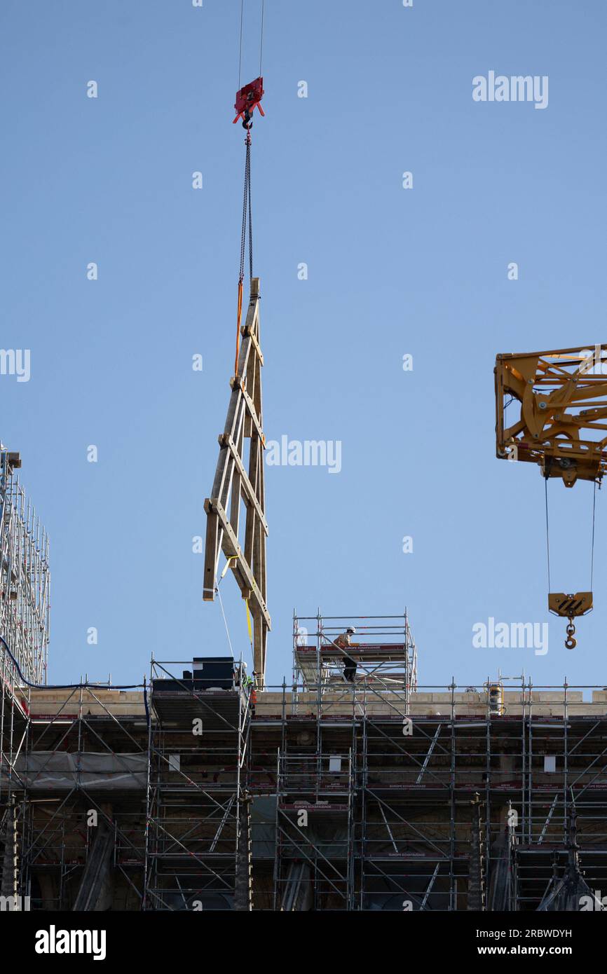 The first 15 meters long and 10 meters high timber truss is craned into ...