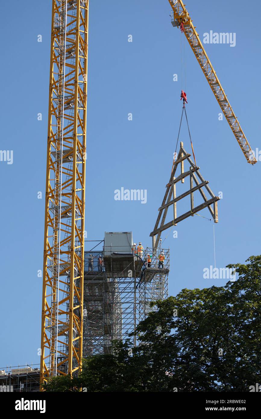 The first 15 meters long and 10 meters high timber truss is craned into ...