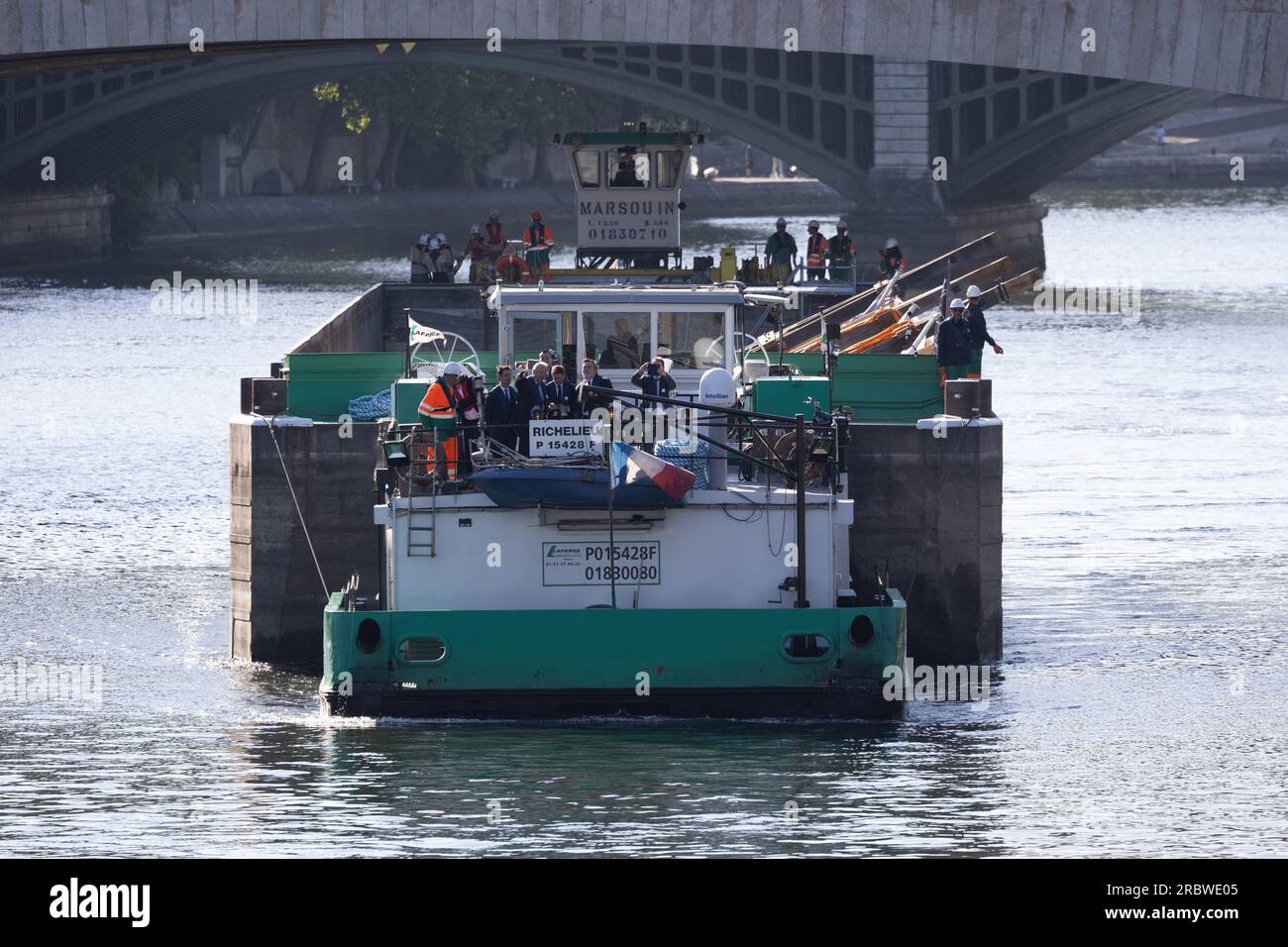 A barge cruises along the River Seine carrying the first truss - 15 ...