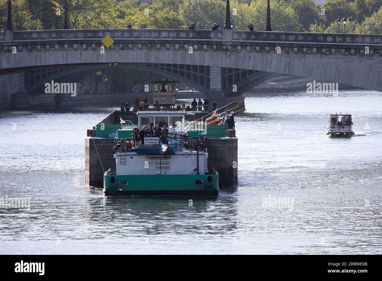A barge cruises along the River Seine carrying the first truss - 15 ...