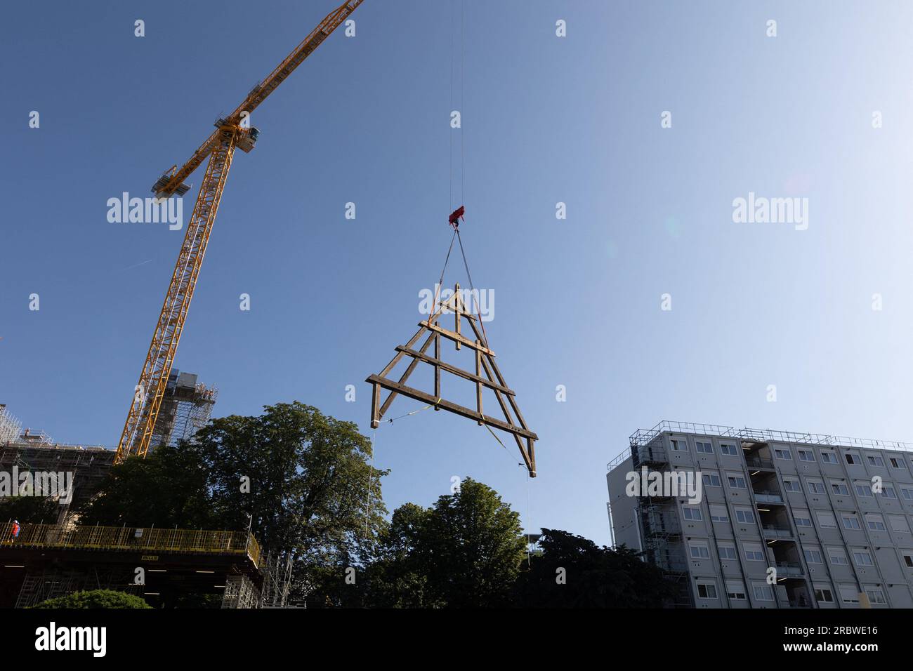 The first 15 meters long and 10 meters high timber truss is craned into ...