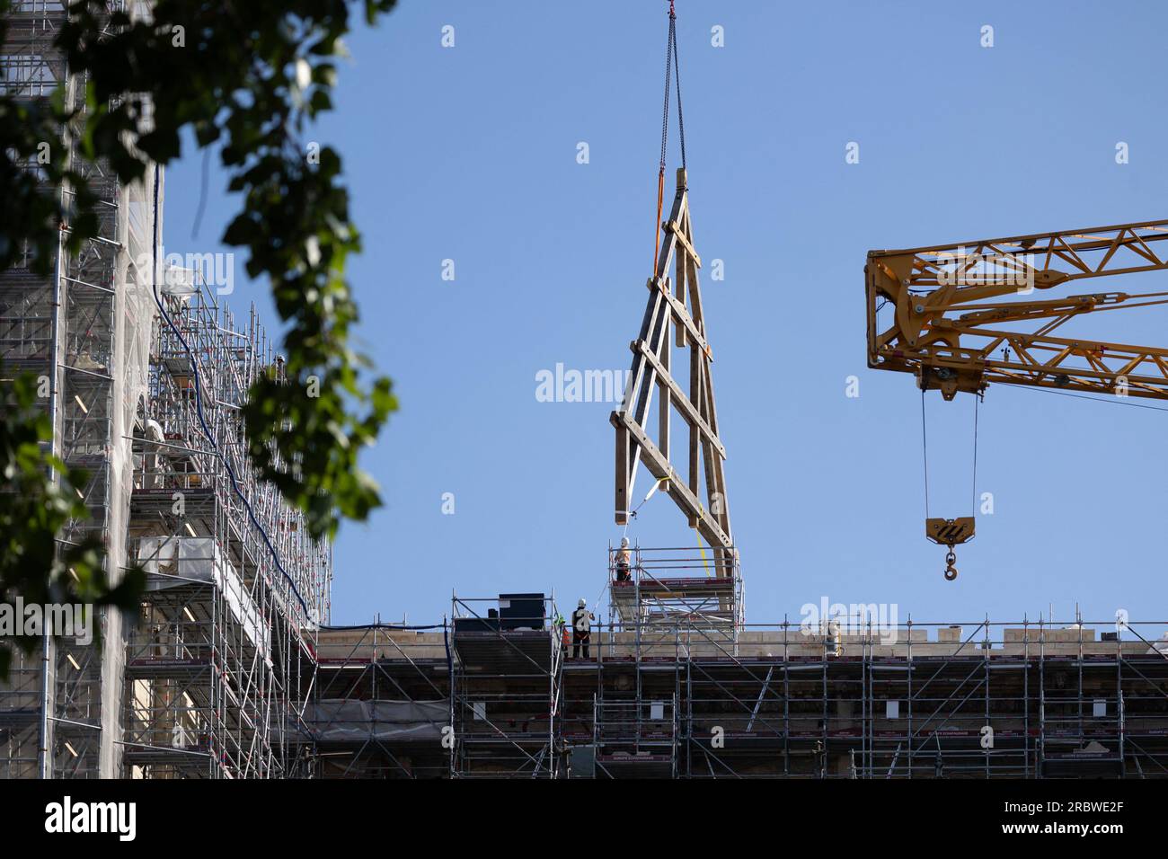 The first 15 meters long and 10 meters high timber truss is craned into ...