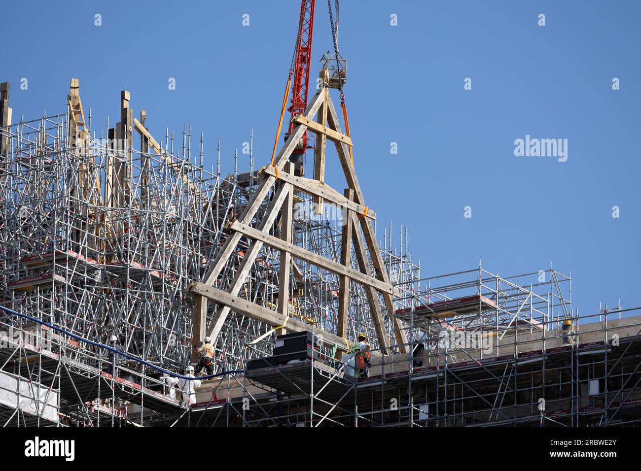 The first 15 meters long and 10 meters high timber truss is craned into ...