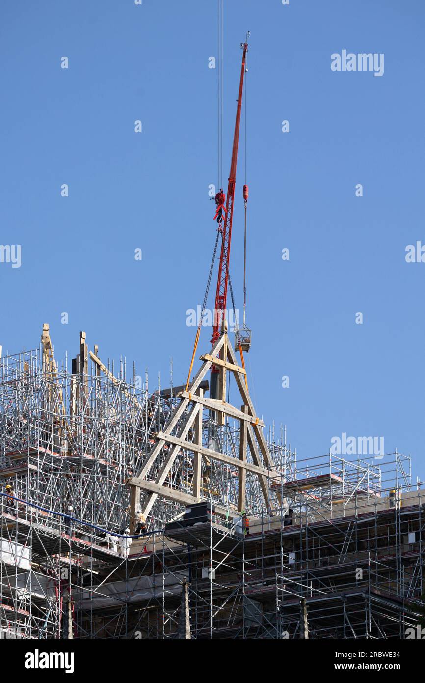 The first 15 meters long and 10 meters high timber truss is craned into ...