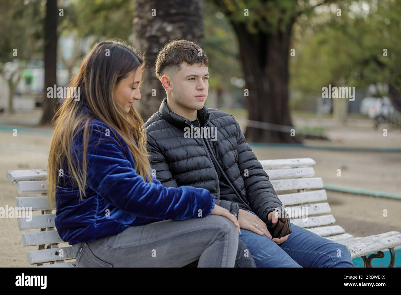 Teen boy sitting on bench hi-res stock photography and images - Alamy
