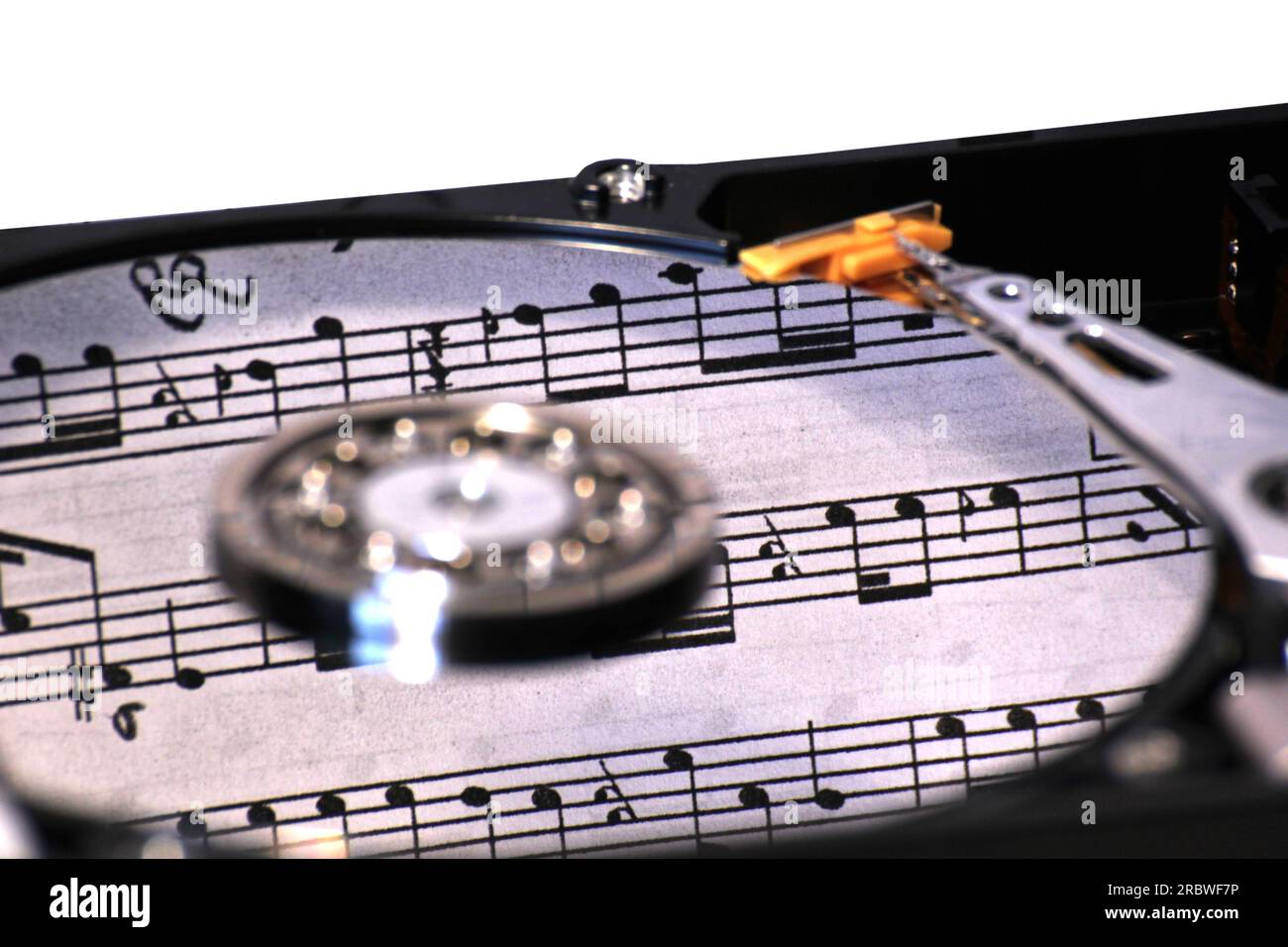 Hard disk on a white background with reflection of music notes Stock ...