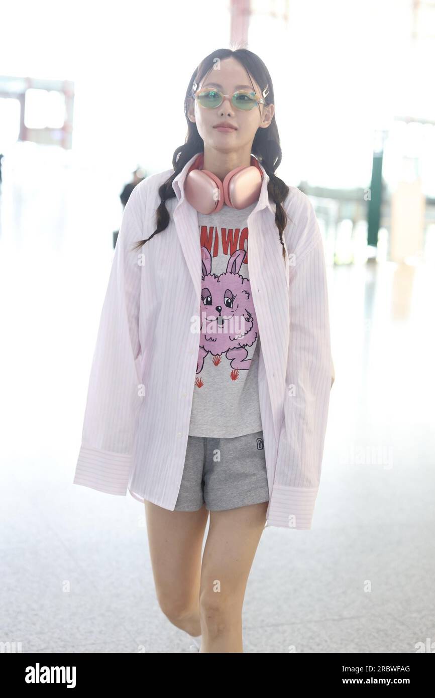 Chinese actress and singer Jenny Zhang appears at airport in Beijing ...