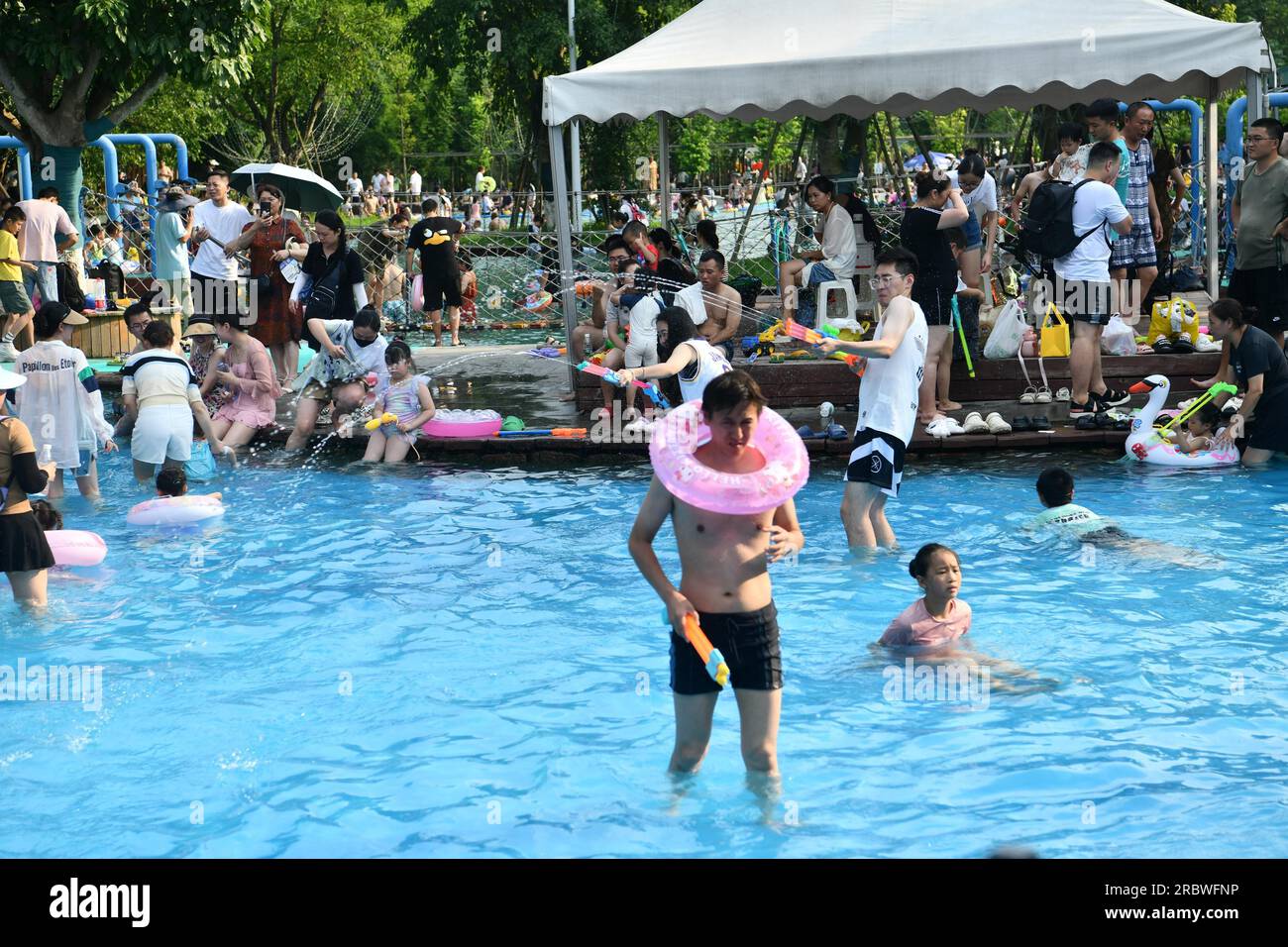 People play at a water park to beat summer heat in Chengdu City ...
