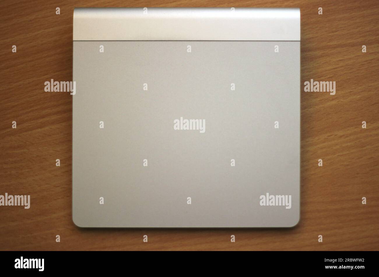 An Apple Trackpad on a desk Stock Photo - Alamy