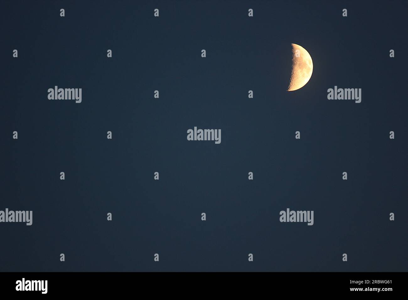 Partial moon in the evening Stock Photo - Alamy