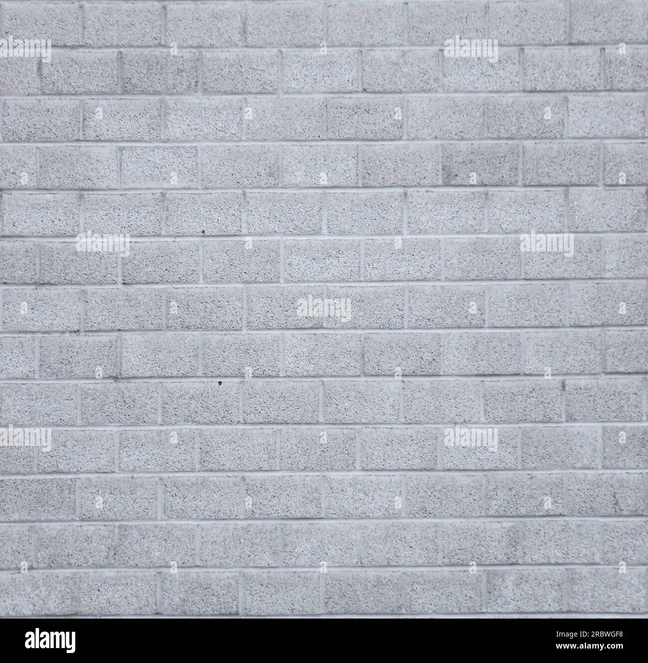 Wall made from concrete blocks/white bricks usable as background or ...