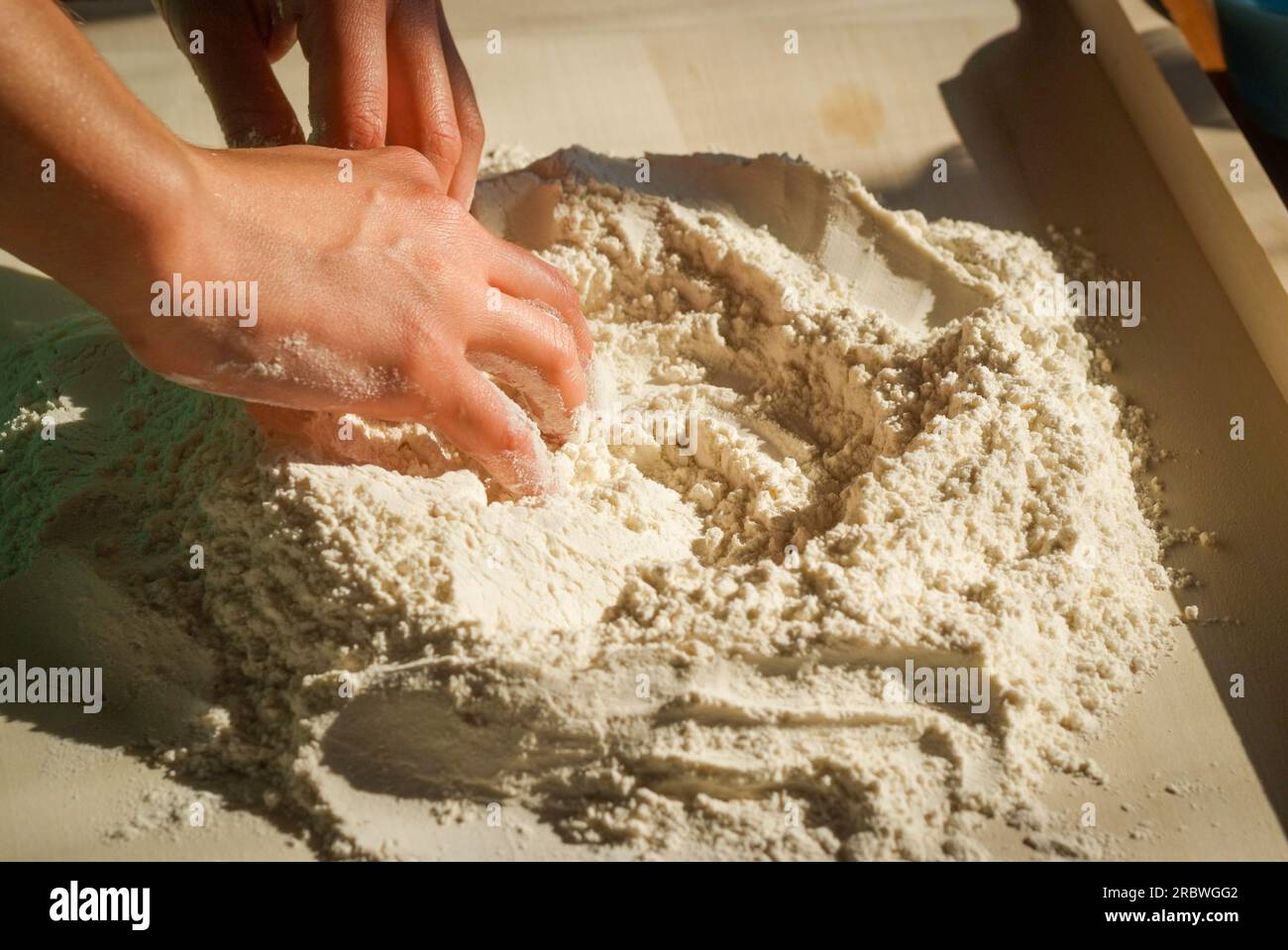 Hands with flour. step by step making blueberry dumplings pierogi ...