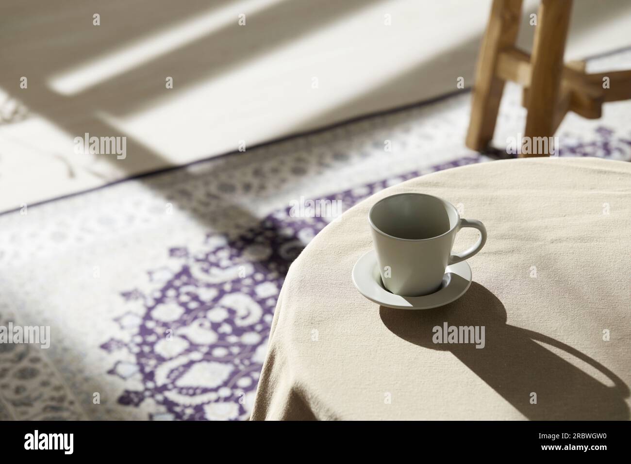 Vases and objects on the table in a warm room with sunlight coming in ...