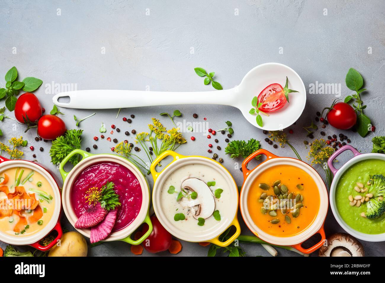 Variety of colorful vegetables cream soups and ingredients for soup ...