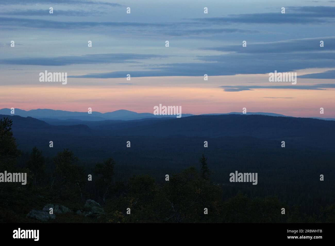 Different shades of blue and orange seen from a Swedish mountain Stock ...