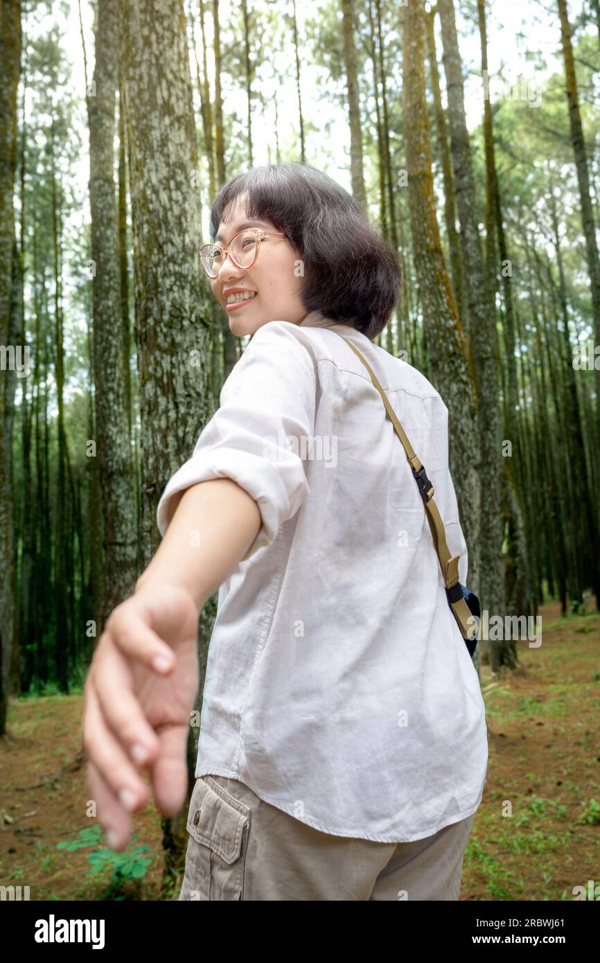 Asian woman walking around in the forest. Traveling activity Stock ...