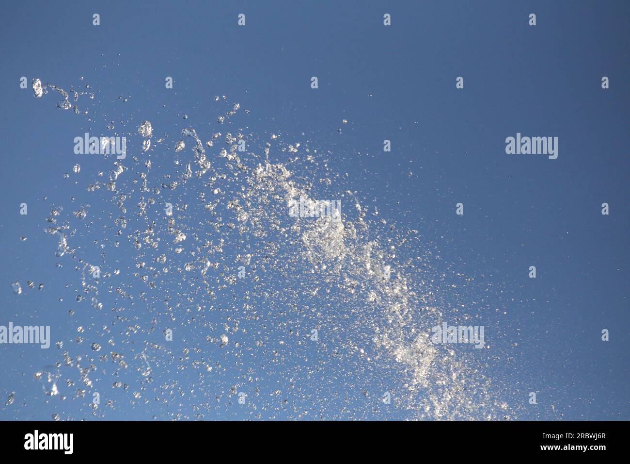 Water drops spraying from a fountain Stock Photo - Alamy