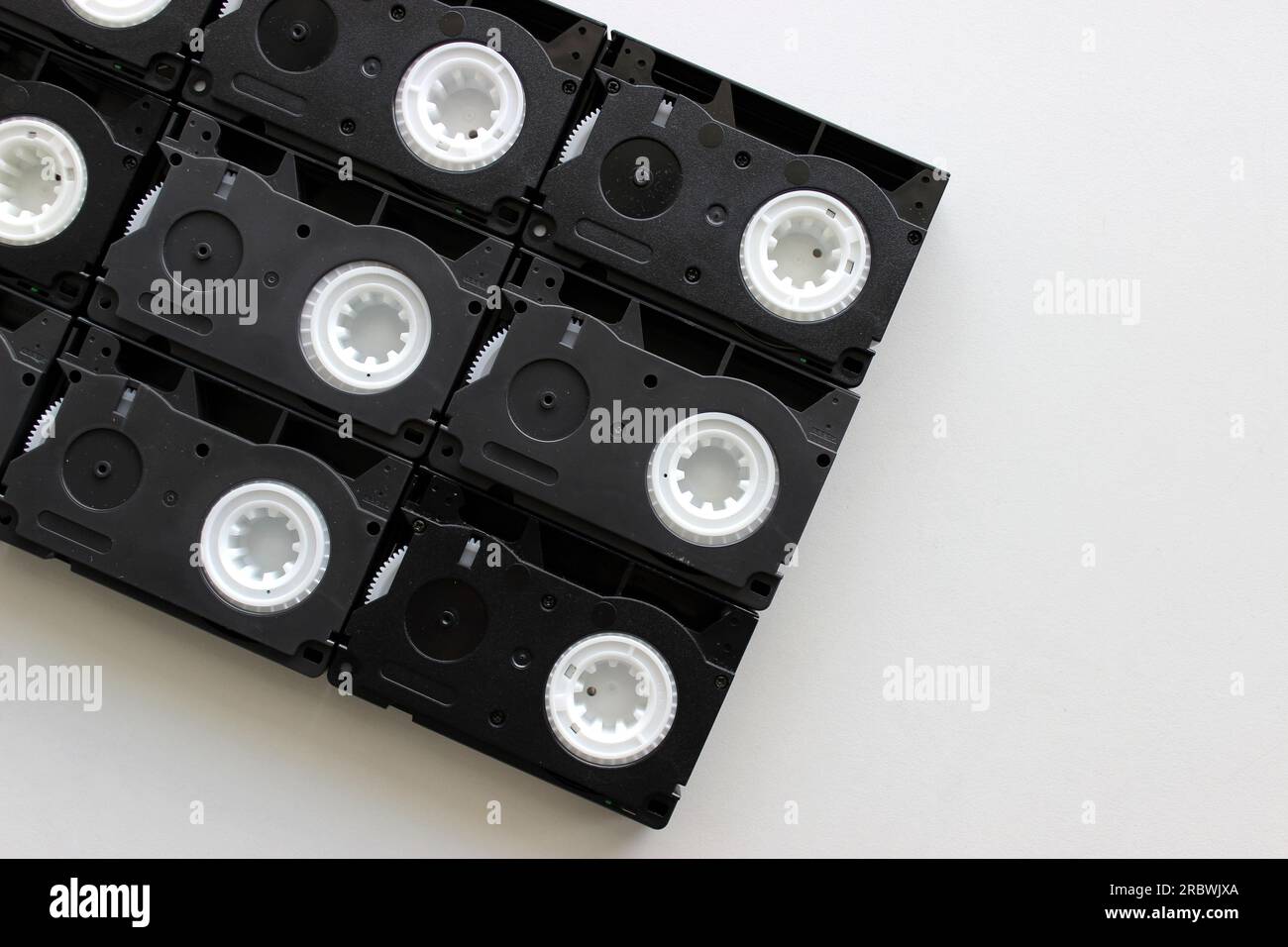 Huge video cassette laid out from small several VHS-С cassettes on ...