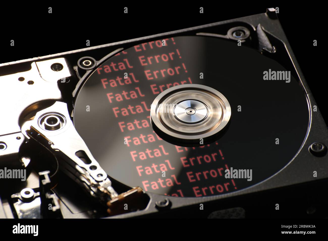Hard disk on a black background, reflecting error message Stock Photo ...